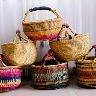 China Natural Straw Wicker Woven Round Seagrass Bolga Baskets Cheapest Wholesale Uk Clothing Organizer Storage Handmade Craft for sale