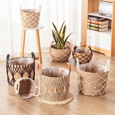 China Wholesale Straw Basket Woven Seagrass Natural Rattan Handmade Storage Plant Basket with Handles for sale