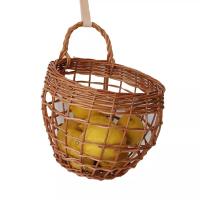 China Home Decoration Natural Wicker Rattan Wall Basket Onions Fruit Hanging Storage Basket for sale