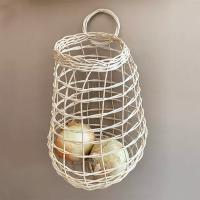 China Home Decoration Natural Wicker Rattan Wall Basket Onions Fruit Hanging Storage Basket for sale