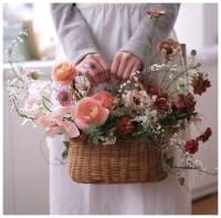 China Oval Shape Handle Flower Basket Indonesian Rattan Woven Mini Waterproof Picnic Basket for sale