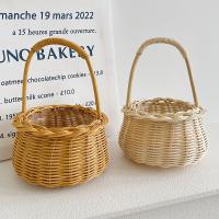 China Wicker Rattan Woven Mini Round Handmade Flower Basket Waterproof Storage Basket for sale