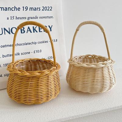 China Wicker Rattan Woven Mini Round Handmade Flower Basket Waterproof Storage Basket for sale