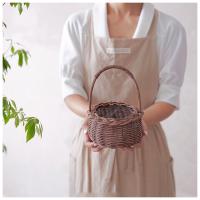 China Wicker Rattan Woven Mini Round Handmade Flower Basket Waterproof Storage Basket for sale