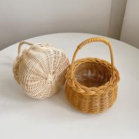 China Wicker Rattan Woven Mini Round Handmade Flower Basket Waterproof Storage Basket for sale