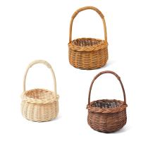China Wicker Rattan Woven Mini Round Handmade Flower Basket Waterproof Storage Basket for sale