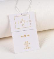 China Biodegradable Stone Paper Packaging Clothing Label Stone Paper Products for sale