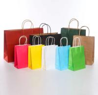 China Bio Degradable Customizable Kraft Paper Bag With Handle Gift Bag Eco Friendly Shopping Paper Bag for sale