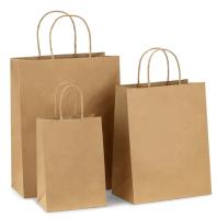 China Custom Logo Brown Kraft Paper Bags Reusable Kraft Packaging Bag With Handles for sale