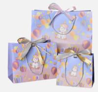 China Promotional Paper Shopping Bags With Logos Luxury Shopping Paper Bag Reusable for sale
