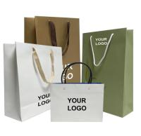 China Cardboard Promotional Custom Printed Luxury Paper Bag With Ribbon Handles For Shopping Bag With Your Own Logo for sale