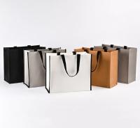 China Custom Color White Heavy Capacity Size Luxury Gift Blank Package Handle Paper Bag Tote Kraft Paper Shopping Bag for sale