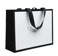 China Customized Logo Print Luxury White Shopping Paper Custom Cardboard Bags With Ribbon Handle for sale