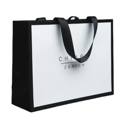 China Customized Logo Print Luxury White Shopping Paper Custom Cardboard Bags With Ribbon Handle for sale
