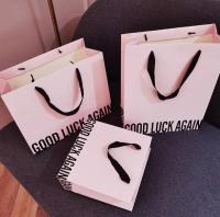 China Printed Retail Clothing Packaging Paper Bag Shopping Packaging Paper Bag for sale