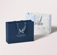 China Custom Printed Shopping Gift Packaging Paper Bag Luxury Black White Retail Thick Paper Bag for sale
