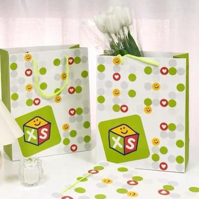 China Clothing Store Flower Paper Shopping Bags Holiday Gift Packaging Bags Tote Bags Custom Printed Logo for sale