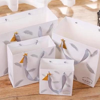 China Custom White Cardboard Printed Paper Bags For Retail Gifts And Promotions for sale