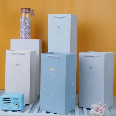 China Cute Tall Paper Gift Bags With Rope Handle Planet Print Design For Baby Gifts And Parties for sale