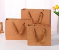 China Handbags Kraft Paper Bags Christmas Packaging Gift Bags For Clothing Store for sale