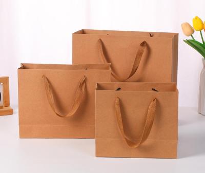 China Handbags Kraft Paper Bags Christmas Packaging Gift Bags For Clothing Store for sale