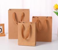 China Handbags Kraft Paper Bags Christmas Packaging Gift Bags For Clothing Store for sale