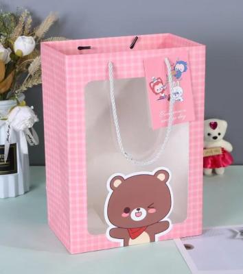 China Custom Paper Gift Bags With Die-Cut Window For Romantic And Festive Packaging for sale