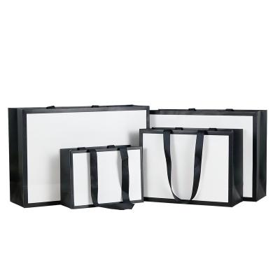 China Elegant Textured Gift Paper Bags Premium Shopping Bags for Clothing Stores Gifting for sale