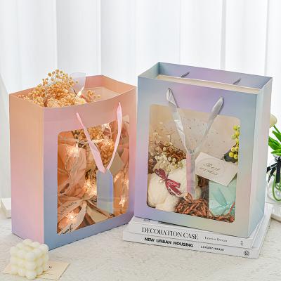 China Pastel Gradient Window Gift Bags with Ribbon Handles Transparent Floral Birthday gift for sale