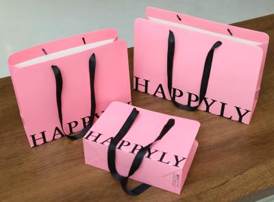 China Custom Kraft Paper Shopping Bags With Logo Eco Friendly Retail Packaging for sale