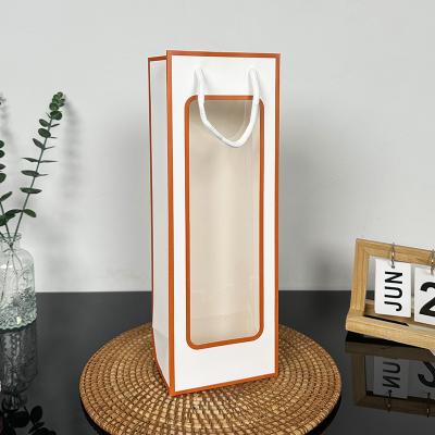 China Premium Kraft Paper Gift Bags with Clear Window Multi Color Rope Handle Packaging for Holidays Weddings Retail for sale