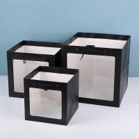 China Elegant Black Gift Bags With Clear Window Premium Kraft Paper Hand Carry Bags For Luxury Packaging for sale