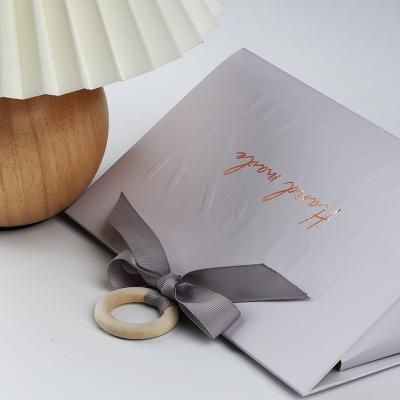 China Gift Bag Multi-Color Wooden Ring Handle Party Gift Box Can Be Customized Logo Paper Box Packaging Box for sale