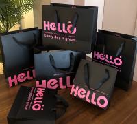 China Luxury Black Paper Shopping Bags With Handles Custom Logo Boutique Gift Bags For Clothing Stores for sale