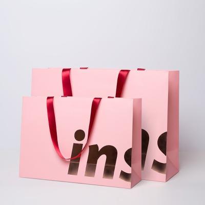 China Pink Kraft Paper Bags 420gsm Thick with Satin Ribbon Handles for sale