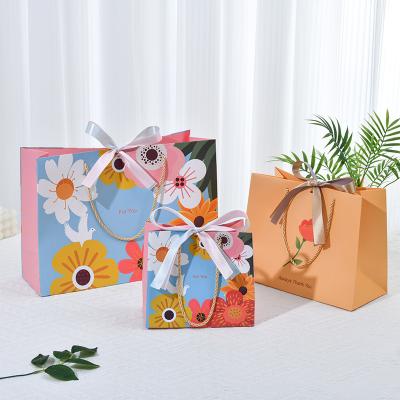 China Customized Pattern Printing Gift Bag Birthday Gift Handbag Simple Packaging Paper Bag Souvenir Gift Bag for sale