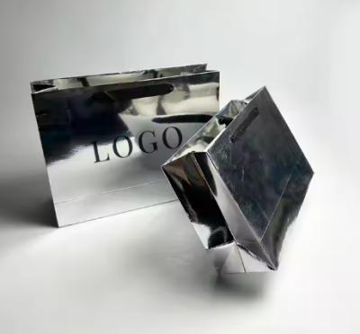 China Custom Silver Paper Gift Bags for Fashion Boutiques for sale