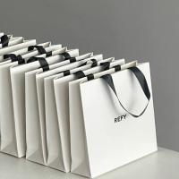 China Custom Logo Kraft Gift Bags with Ribbon Handles for Boutiques for sale