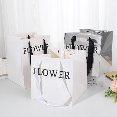 China Custom Printed Paper Tote Bags for Boutique Shopping for sale