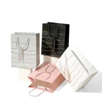 China Custom Luxury Wave Embossed Gift Bags with Gold Foil for sale