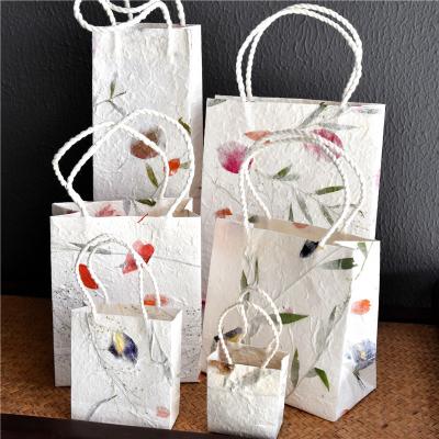 China Handmade Herb Paper Gift Bags Natural Fiber Pressed Flower Pouches Eco Friendly Wine Decor Packaging for sale