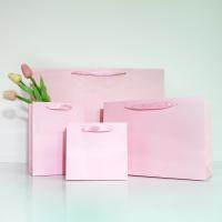 China Thickened Pure Light Pink And White Cardboard Bag Clothing Packaging Bag Gift Handbag Souvenir Bag for sale