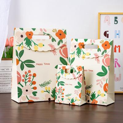 China Cartoon Flower Candy Packaging Bag Holiday Gift Bag White Cardboard Bag Souvenir Handbag Storage Bag Gift Bag for sale