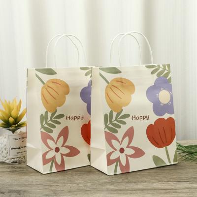 China Floral Printed Kraft Paper Gift Bags Versatile For GiftsApparel Shopping  Coffee for sale