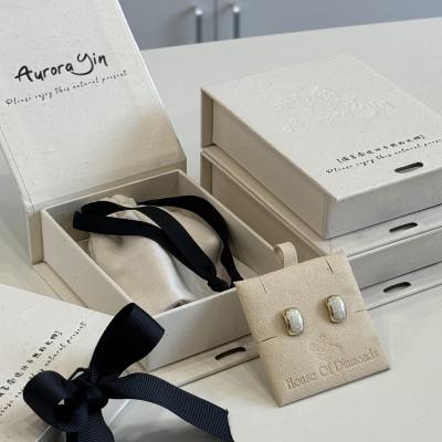 China Luxury Book Shaped Jewelry Box Magnetic Flip Top With Silk Bow Premium Gift Packaging For Necklaces Bracelets for sale