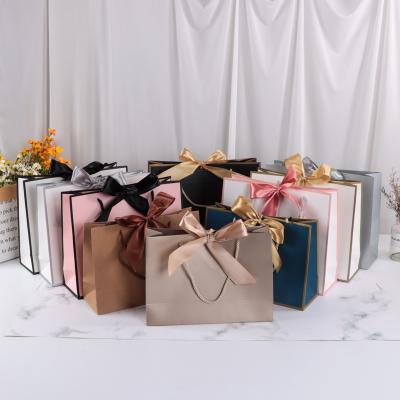 China Bowknot Paper Shopping Bag For Cosmetics Multi-Color Gift Bag Packaging Clothing Shopping Bag With Logo Printing for sale