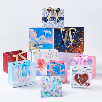 China Customized Pattern Foreign Trade Paper Bags Holiday Gift Bags Color Printing Packaging Bags for sale