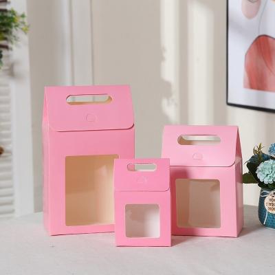 China Simple Flip-Top Kraft Paper Gift Box With Window Gift Bag Creative Candy Packaging Paper Bag for sale