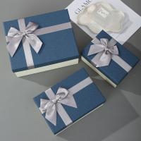 China Luxe Blue Gift Box Set Premium Hinged Cosmetic Perfume Packaging With Silver Ribbon for sale