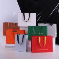 China Hot Stamping Handbags With Customized Logo Thickened White Cardboard Shopping Paper Bags for sale